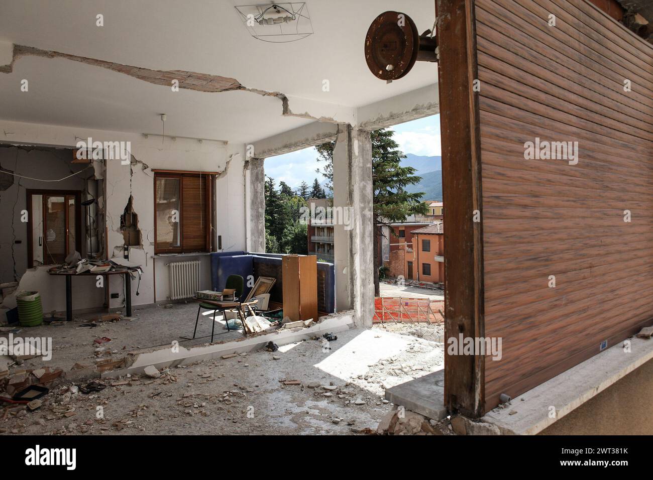 The interior of a partially collapsed house, waiting reconstruction ...