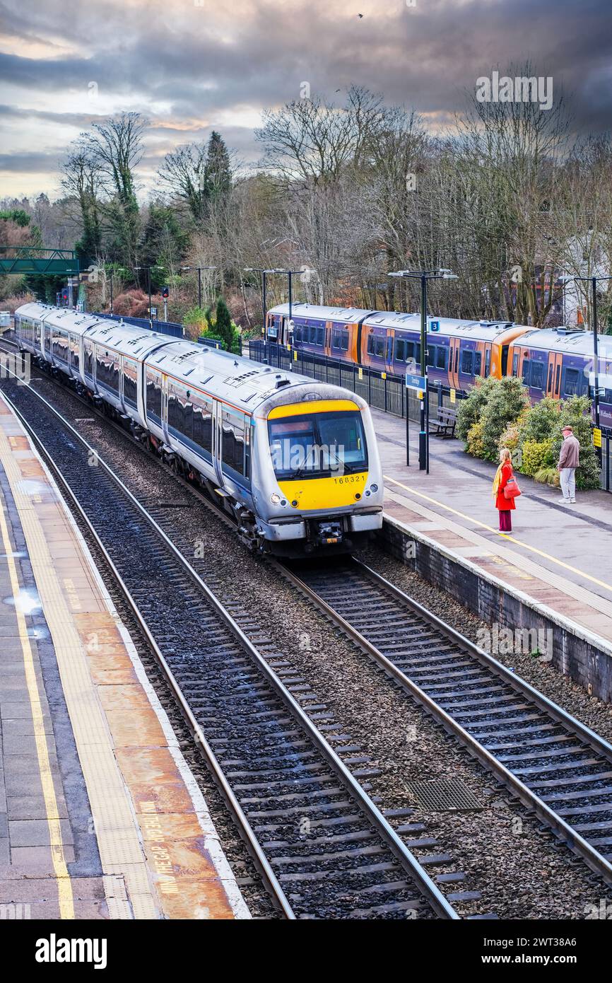 Diesel powered passenger commuter railway train and station. West ...
