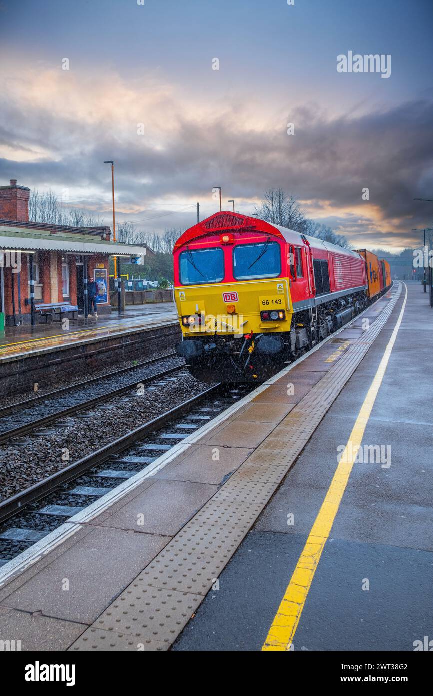 Diesel powered passenger commuter railway train and station. West ...