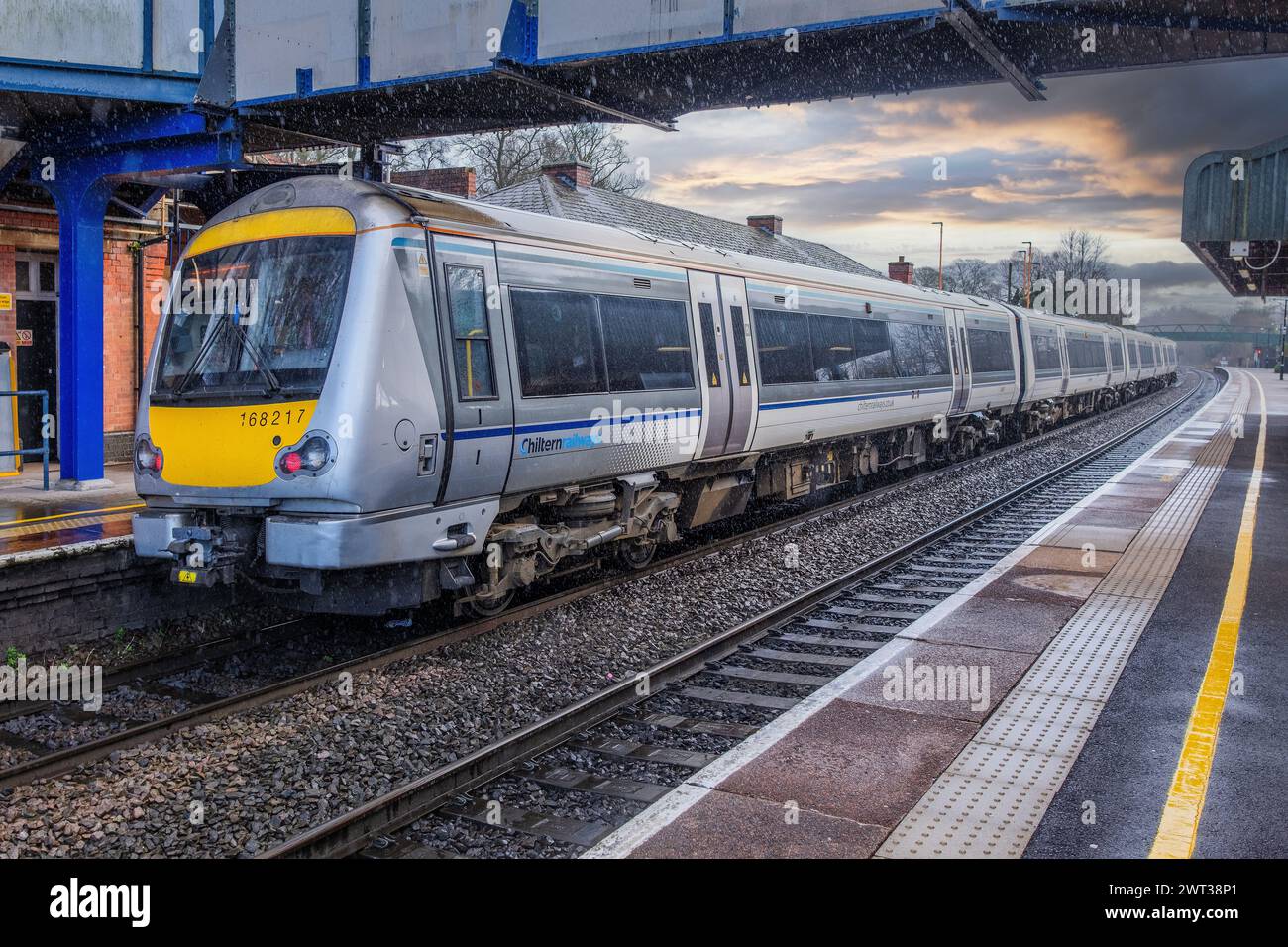 Diesel powered passenger commuter railway train and station. West ...