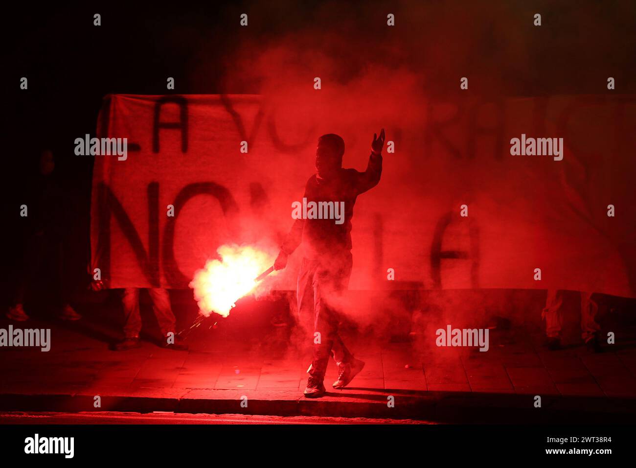 A man with a smoke bomb protests against the partial lockdown measures ...