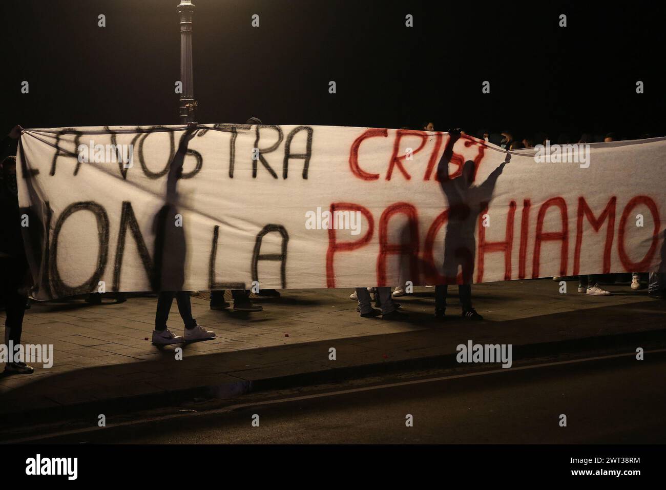 People with a banner protest against the partial lockdown measures of ...
