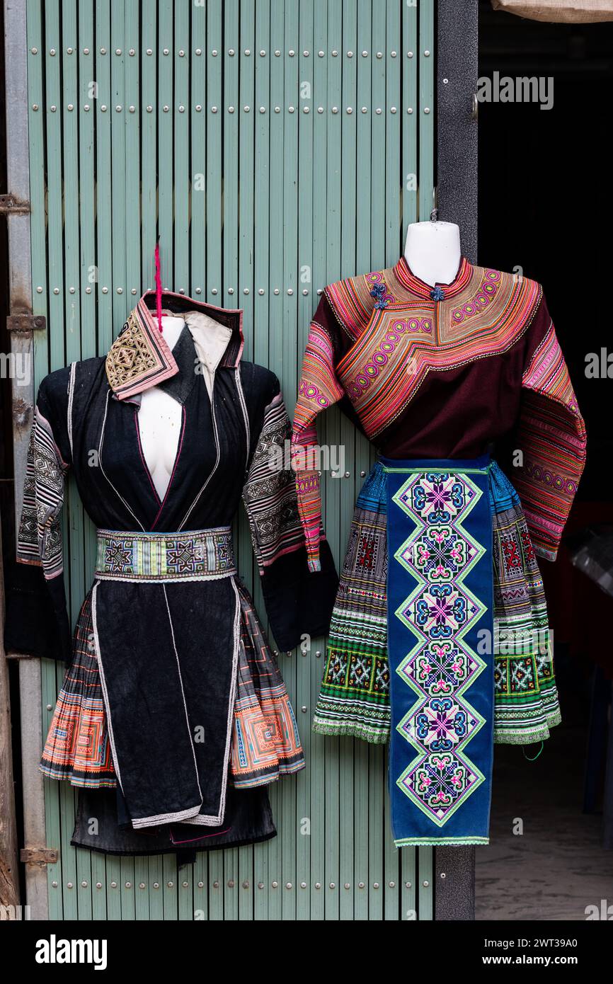 Traditional Hmong womens' dress of colorful, layered , embroidered ...