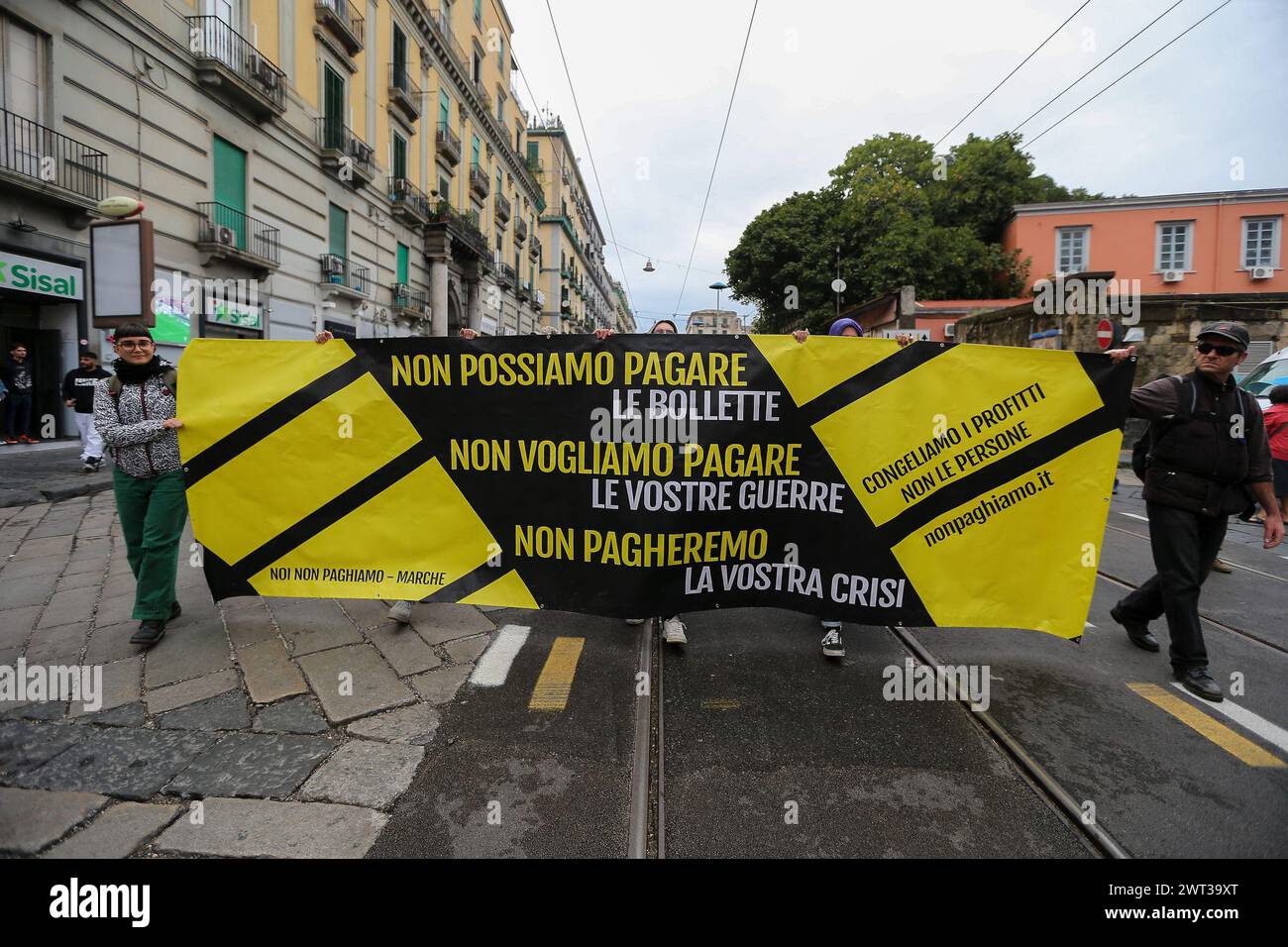 People with a banner, during the demonstration in Naples "We Rise Up ...