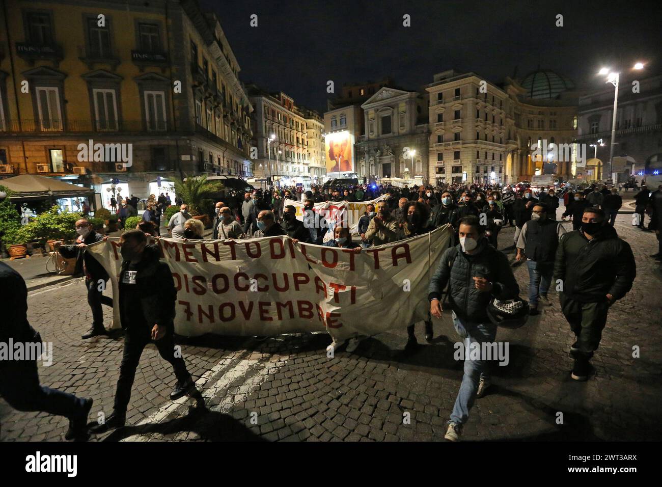 People with a banner protest against the partial lockdown measures of ...