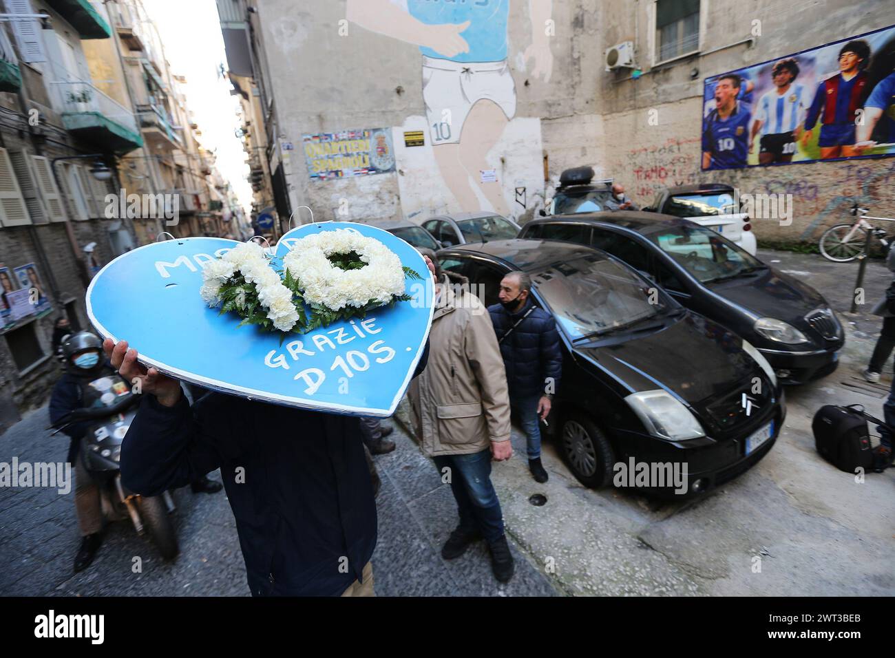 A man carries a giant heart dedicated to Diego Armando Maradona, in the ...