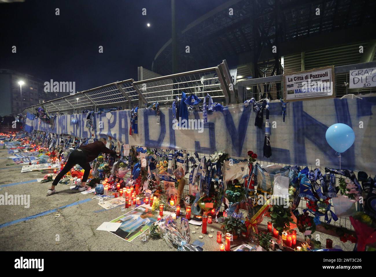 Memorabilia and tealights of Diego Armando Maradona, left by fans in ...