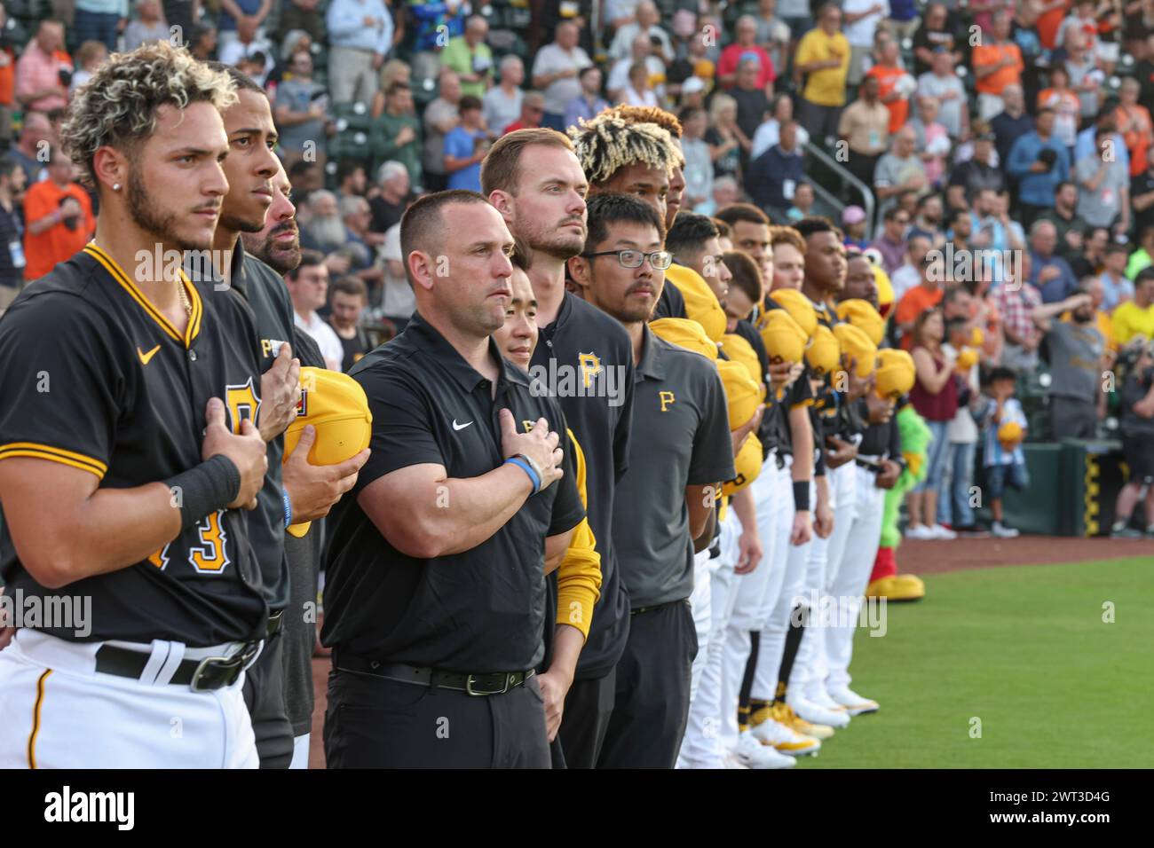Bradenton, FL: The Pittsburgh Pirates stand with hats on their hearts ...