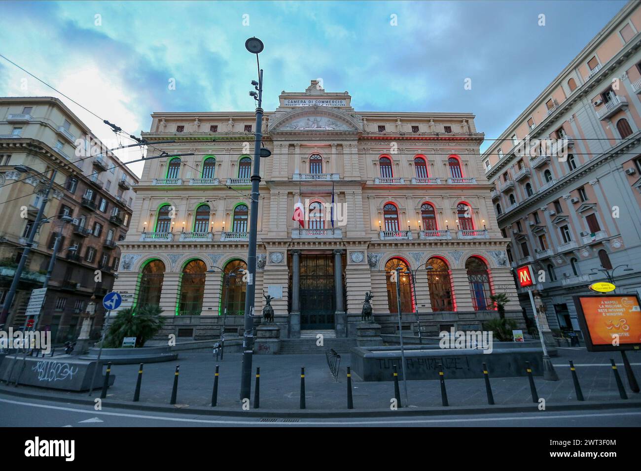 A view of the chamber of commerce building in Naples, illuminated with ...