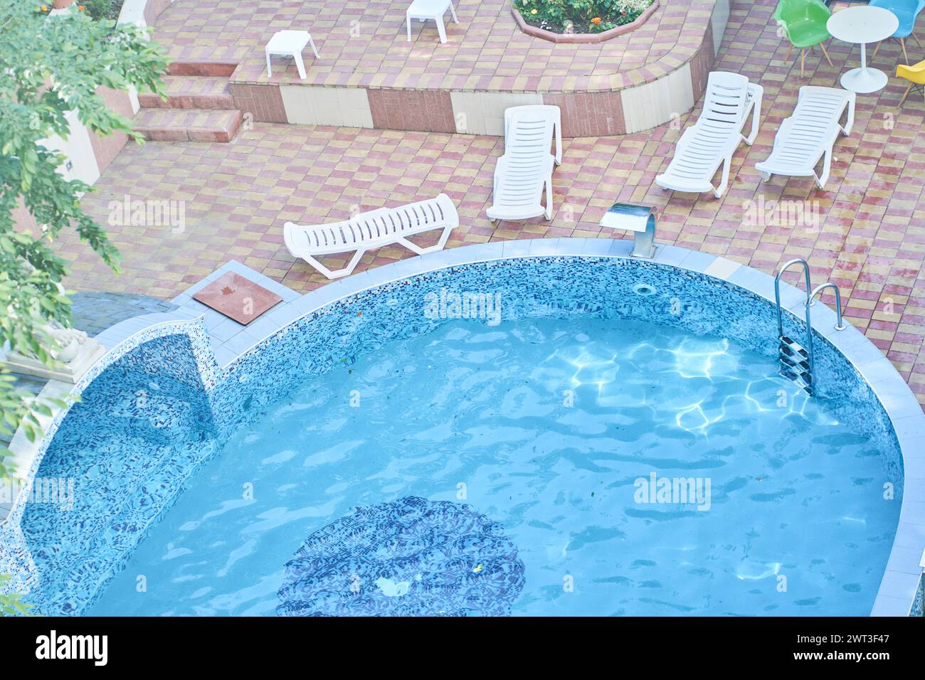 Top view of the hotel territory with round outdoor swimming pool with ...