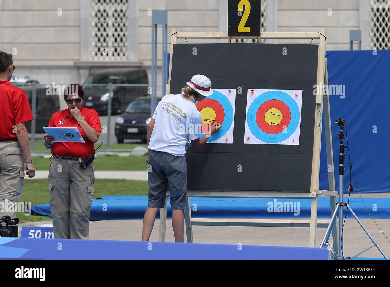 The judges check the score on the targets, during the compound team ...