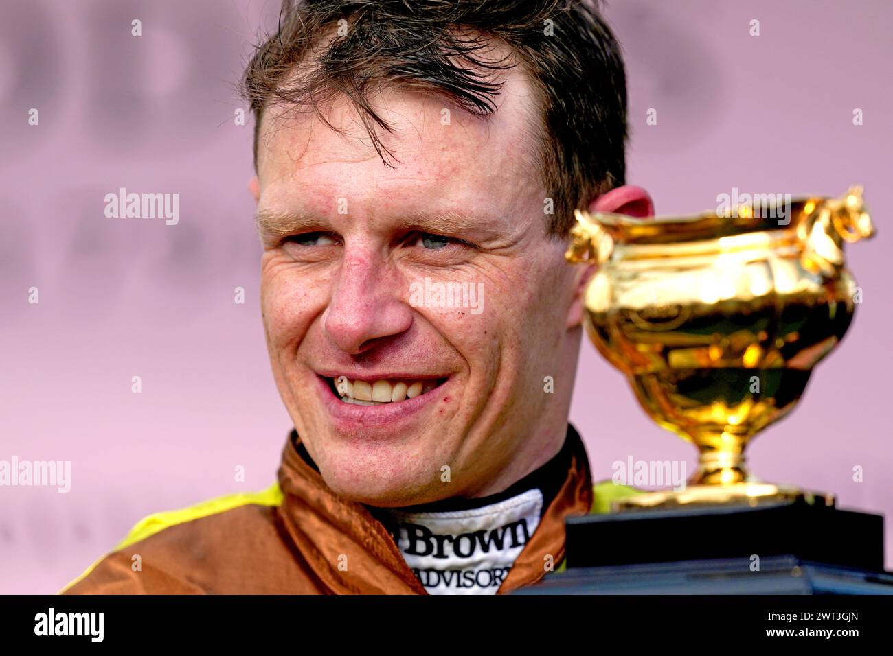 Jockey Paul Townend celebrates with the trophy after winning the ...