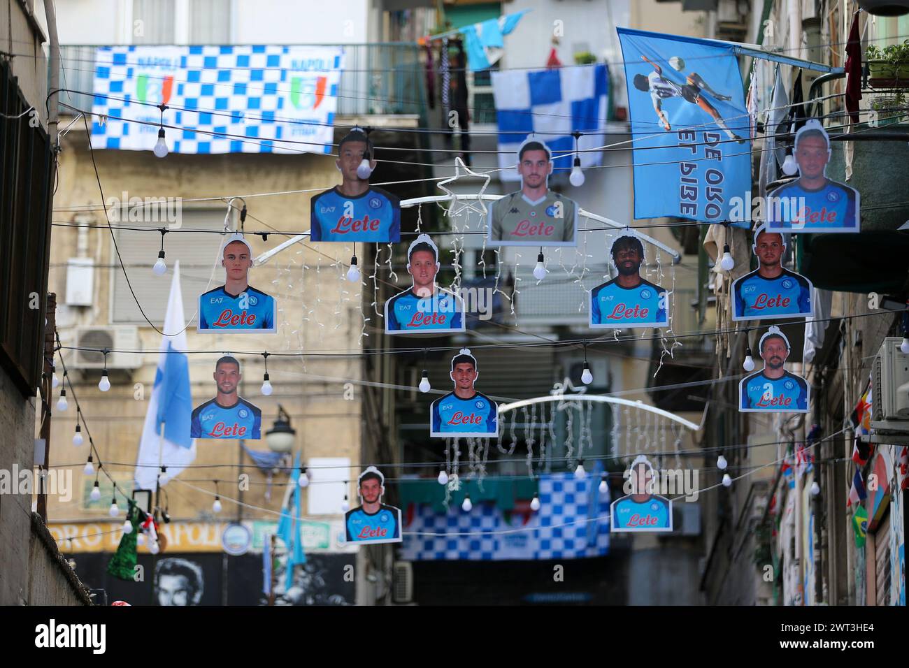 An alley in the Spanish quarters of the city of Naples, decorated by fans with Napoli players ...