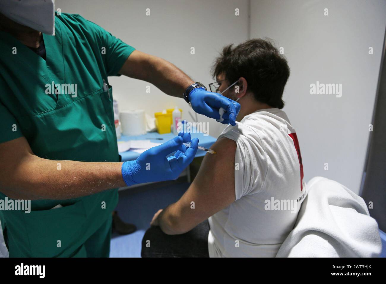A person getting vaccinated inside a room of the vaccination center in ...