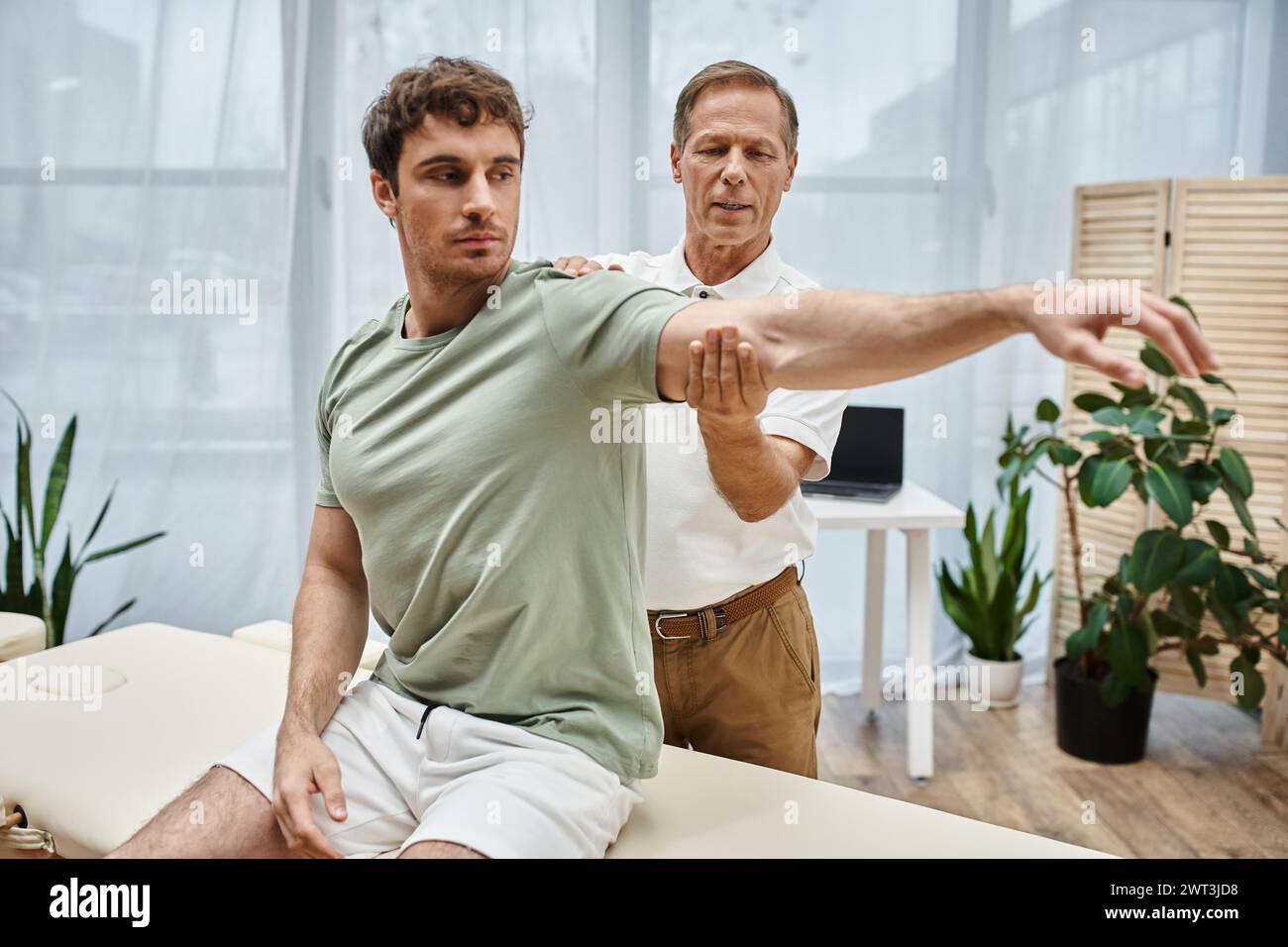 handsome jolly doctor in uniform helping his good looking patient to ...