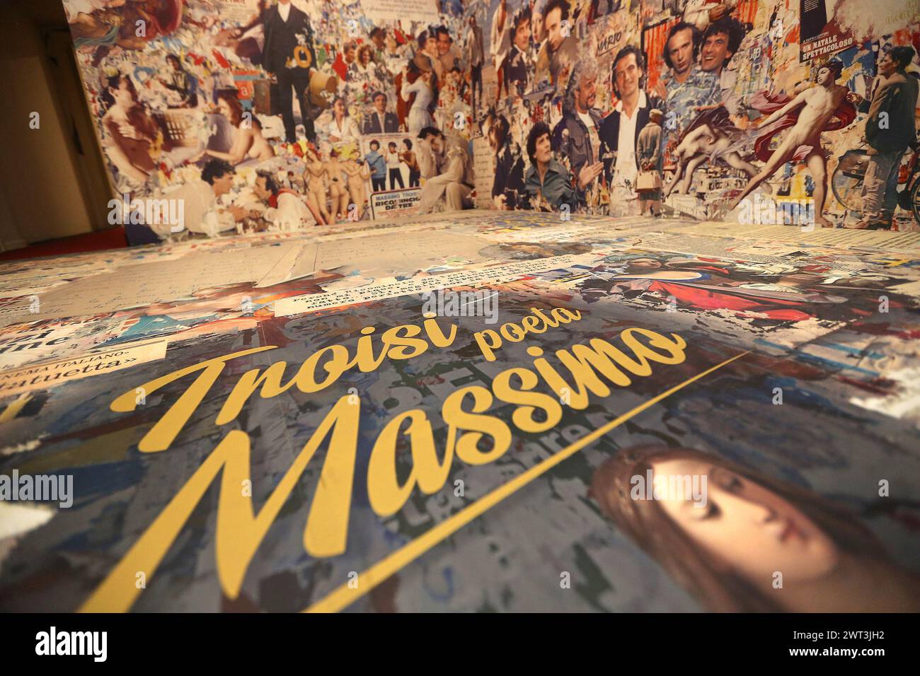 A room covered with collages of posters and photographs, inside the ...