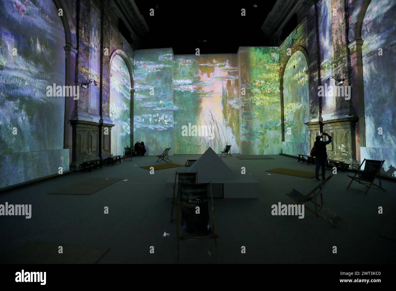 Claude Monet's paintings projected on the walls, inside the "Monet: The ...