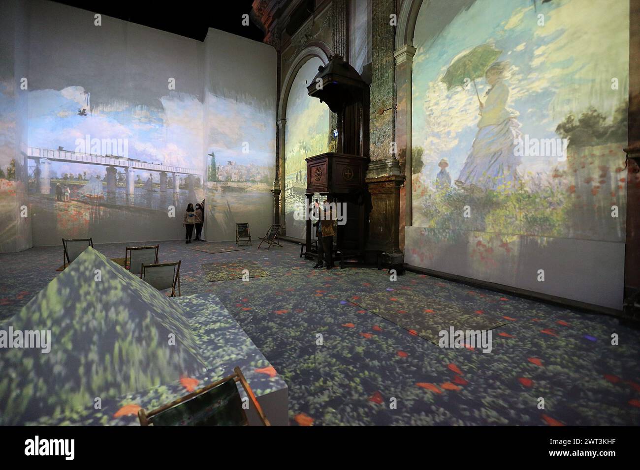 Claude Monet's paintings projected on the walls, inside the “Monet: The ...