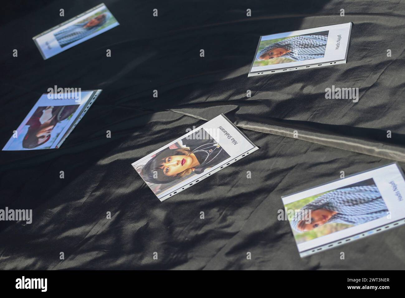 Photographs of Iranian women on a black cloth, during the demonstration ...