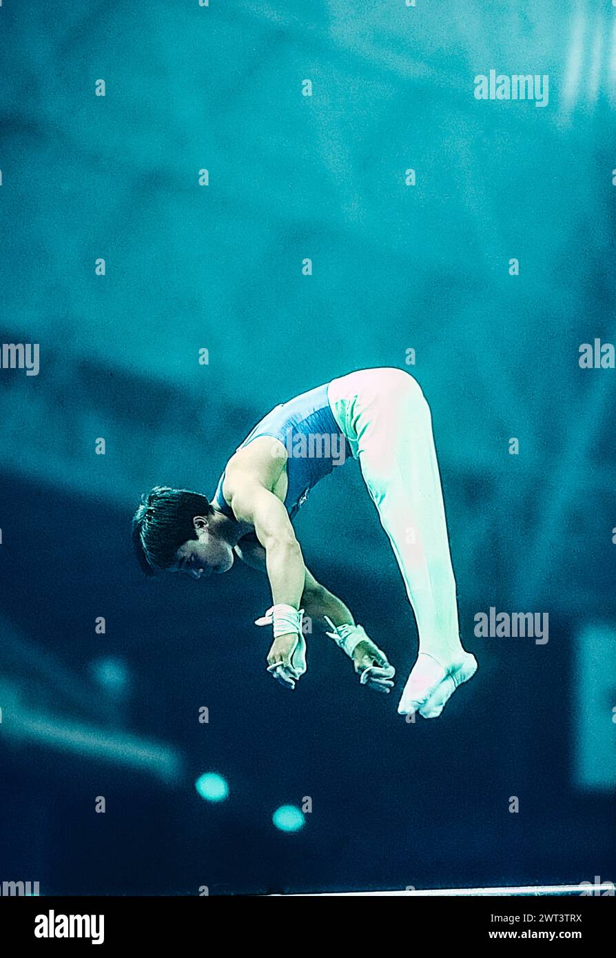 Sin Myong-Su (PKR) competing in the men's artistic team all-around ...