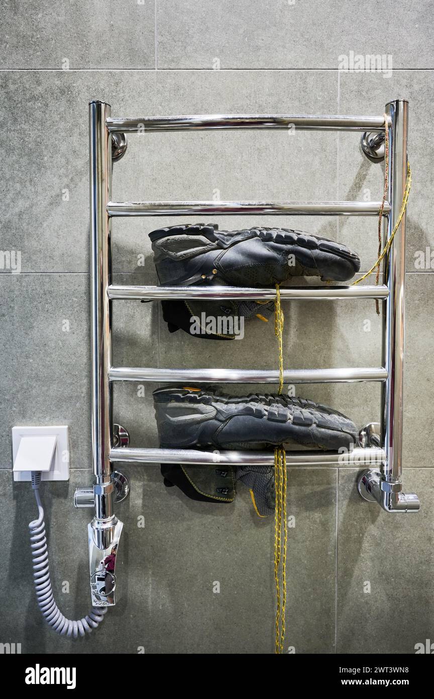 Hiking shoes drying after big camping. Black boots for hiking lying on ...