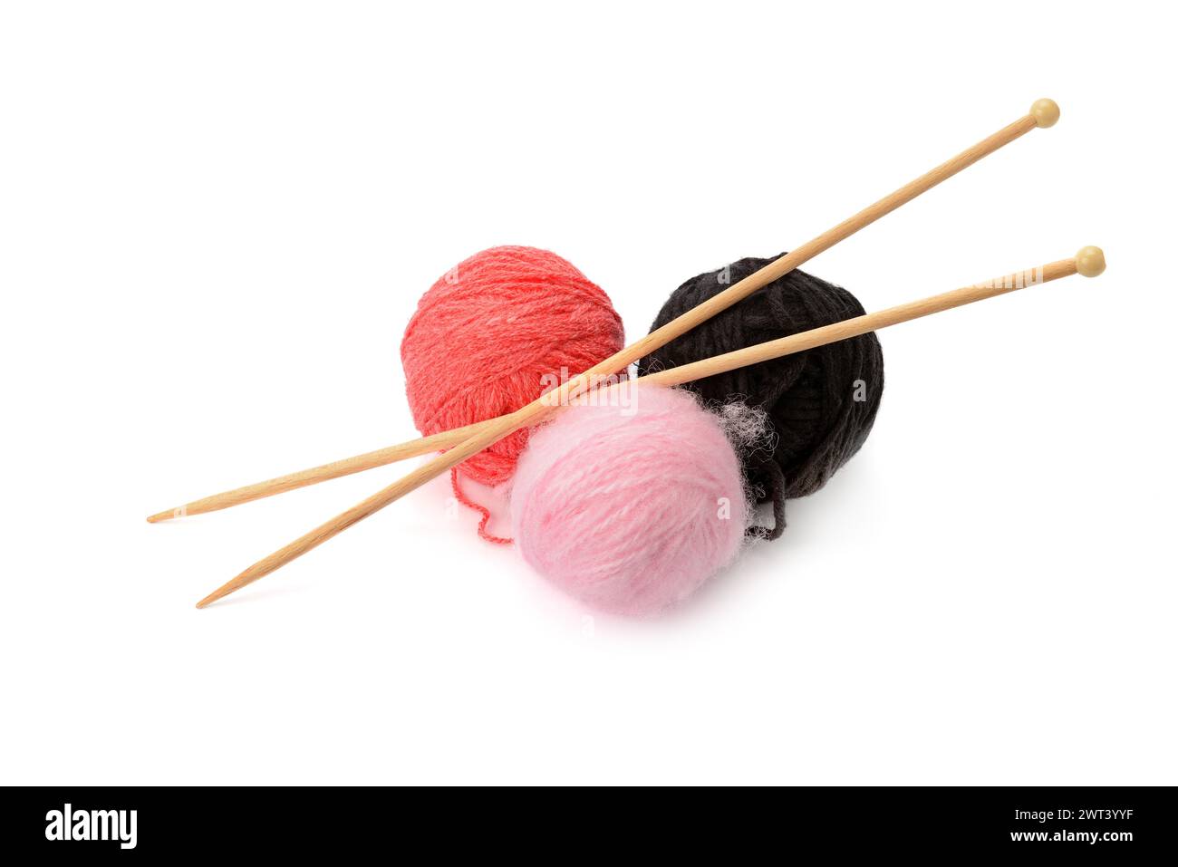 Multi-colored balls and knitting needles isolated on a white background ...