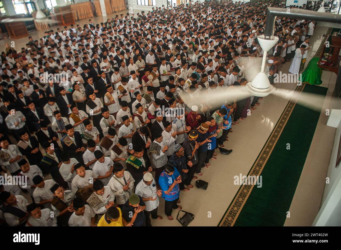 Muslim students are seen during the Muslim funeral prayer procession in ...