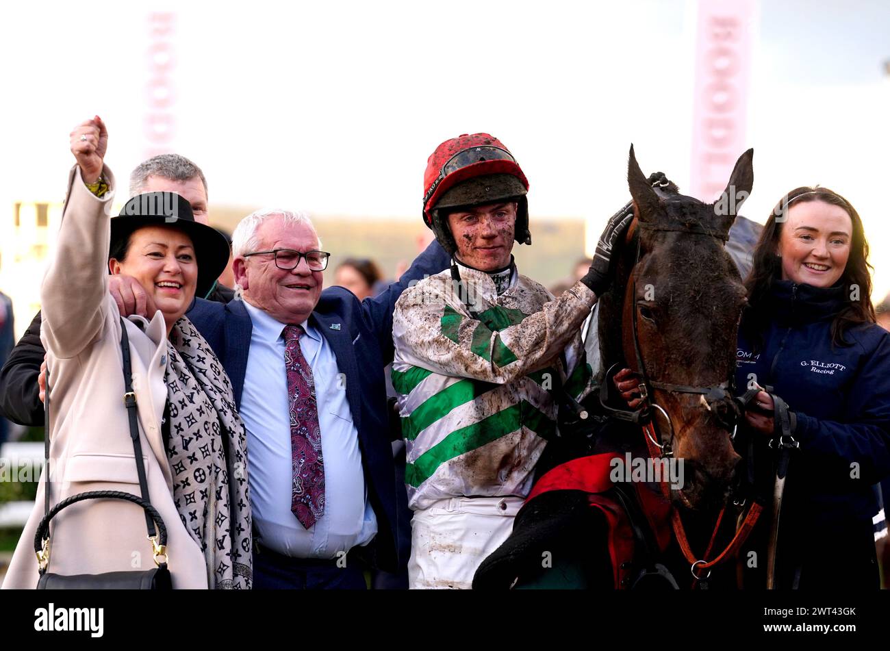 Jockey Danny Gilligan (centre right) poses for a photo as they celebrate after Better Days Ahead ...