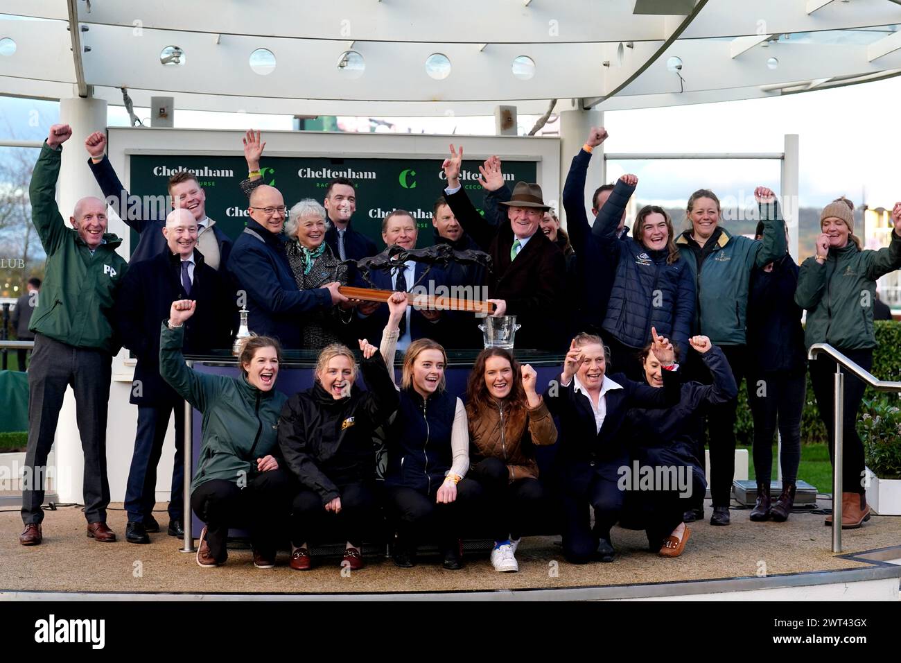Willie Mullins poses for a photo with his connections after winning the ...