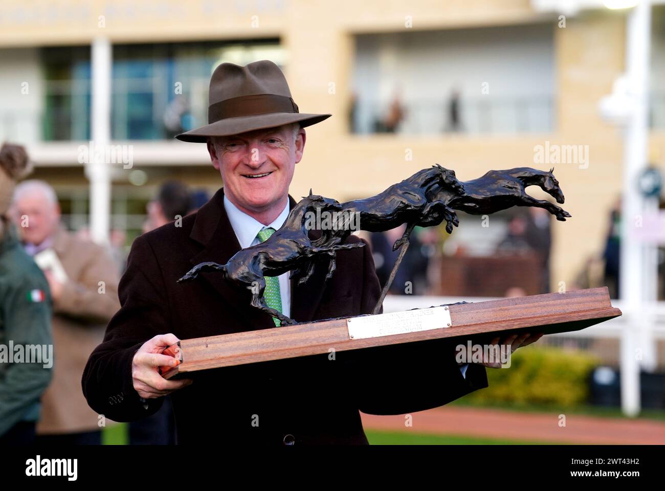 Willie Mullins poses for a photo with the leading trainer trophy on day ...