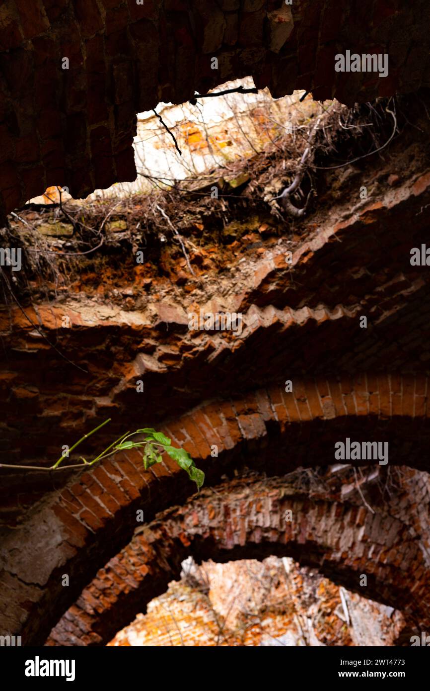 The old ruins of the collapsed walls with gates and windows ...