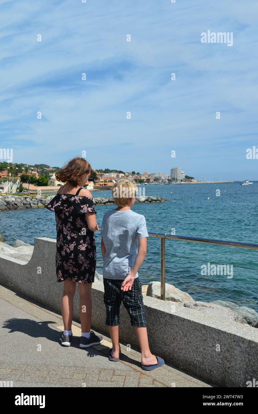 Two children stand hi-res stock photography and images - Alamy