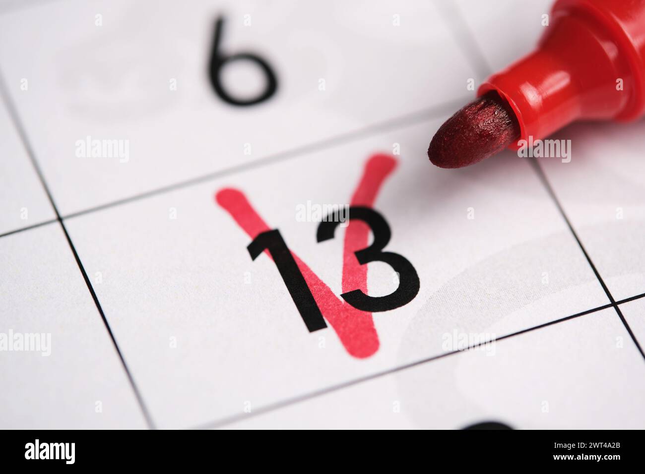 13th day on the calendar is marked with a red marker.Friday the ...