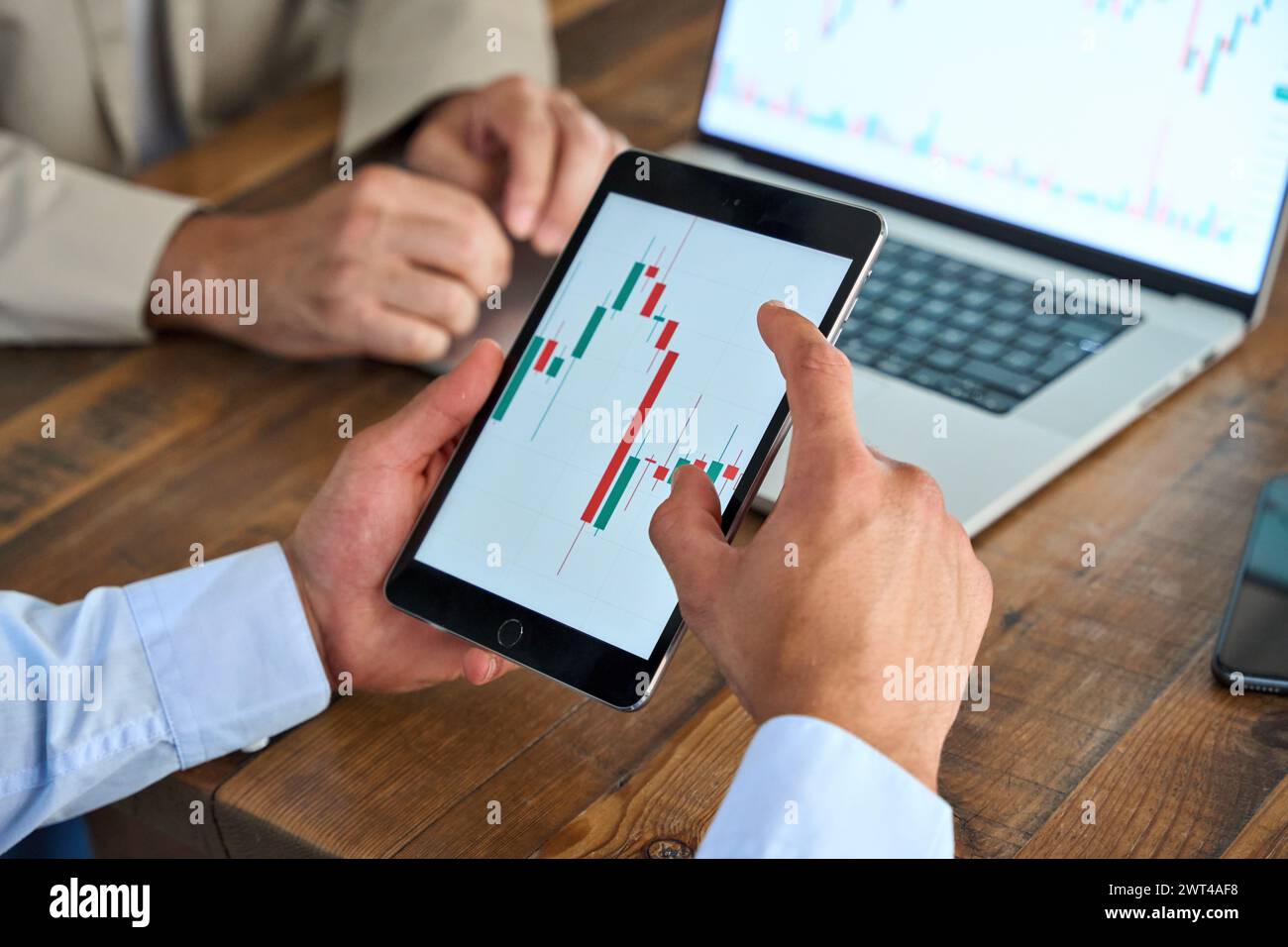 Stock market investor analyzing trade charts invest trends on tablet ...