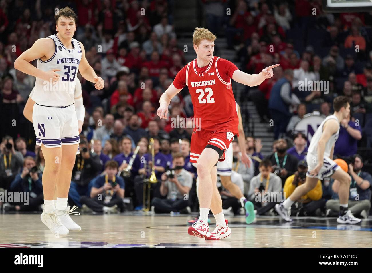 Wisconsin forward Steven Crowl (22) points after making a 3-point ...