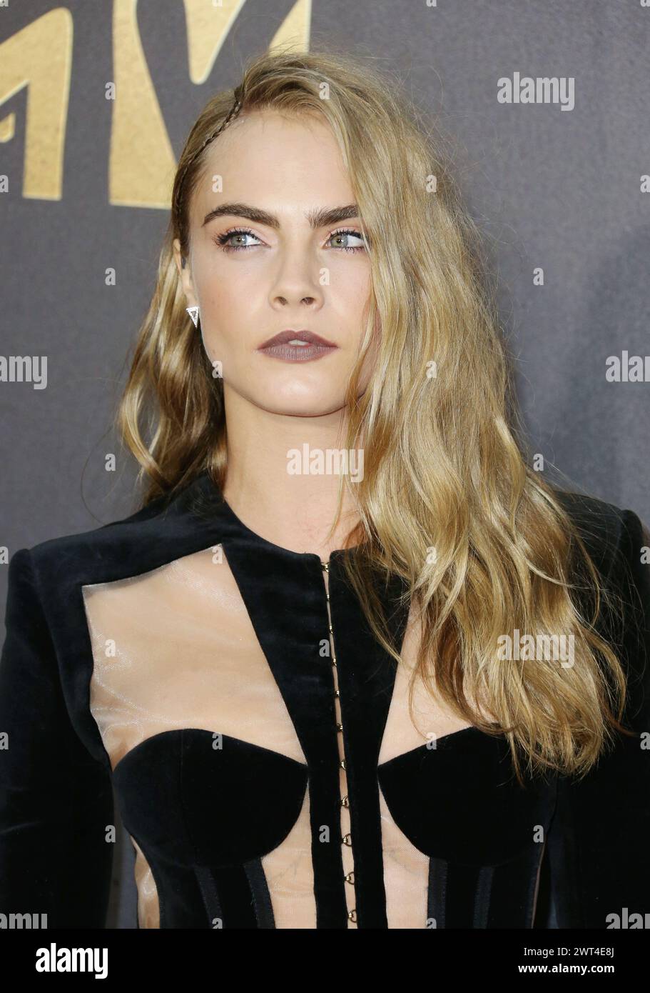 BURBANK, CA - APRIL 09: Model Cara Delevingne attends the 2016 MTV ... BURBANK, CA - APRIL 09: Model Cara Delevingne attends the 2016 MTV ...