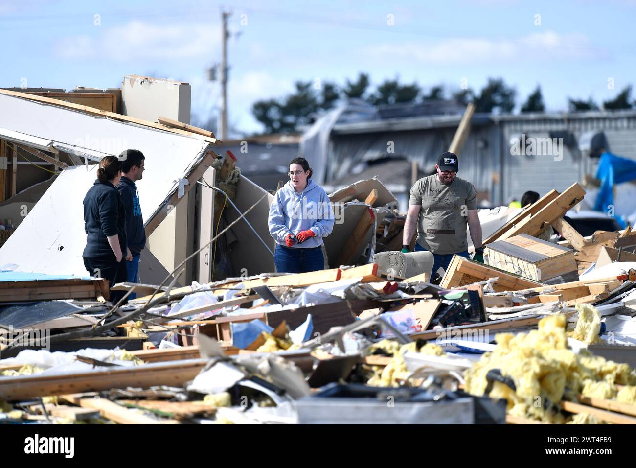 Members of the congregation of the Freedom Life Church pick through the ...