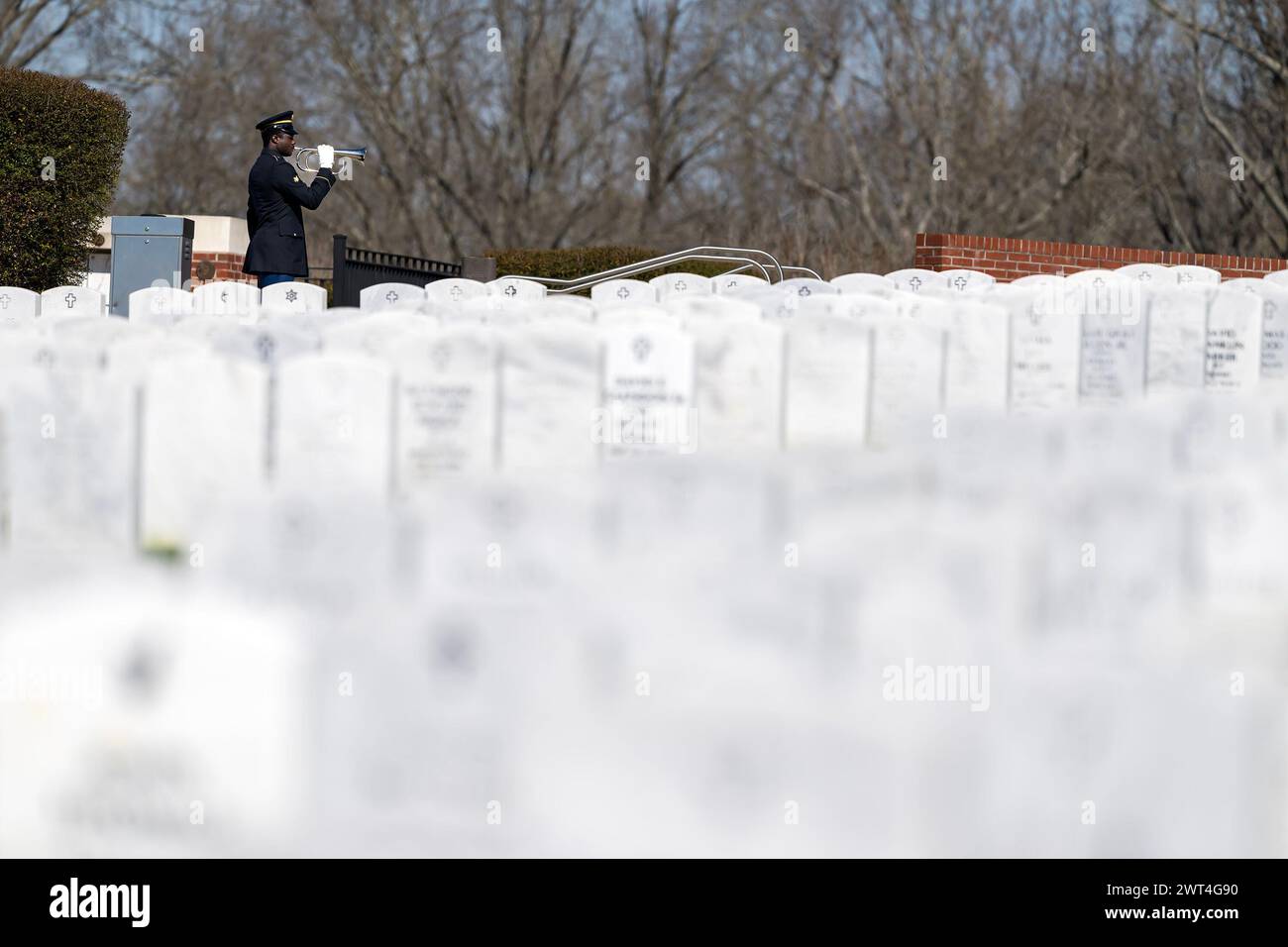 A poignant moment unfolds as a Soldier plays taps, honoring a fallen ...