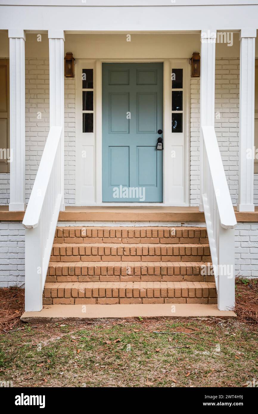 The front exterior entrance of a newly aqua blue painted front door on ...