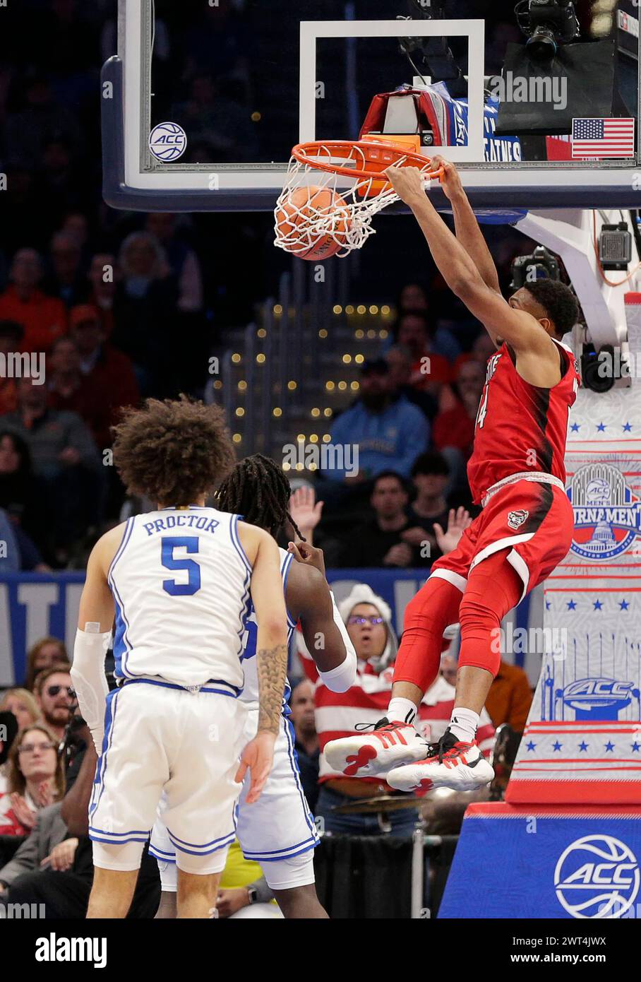 March 14, 2024: NC State Wolfpack Guard (14) Casey Morsell dunks the ...