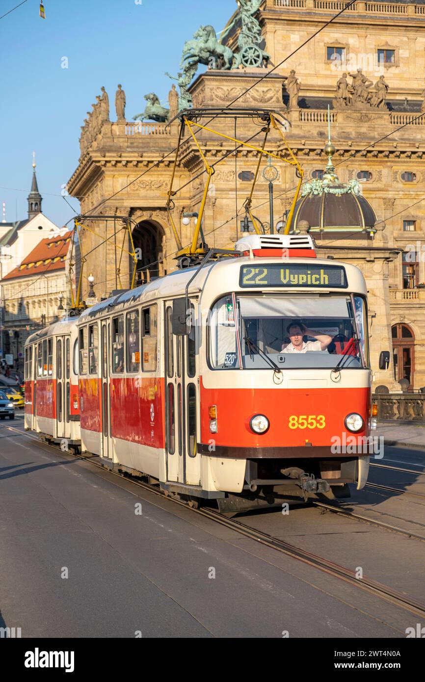 Iconic red and cream tram approaching in prague's daylight with ...