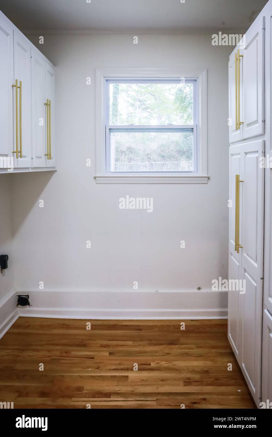 Updated white shaker cabinets with elegant gold sleek thin hardware in ...