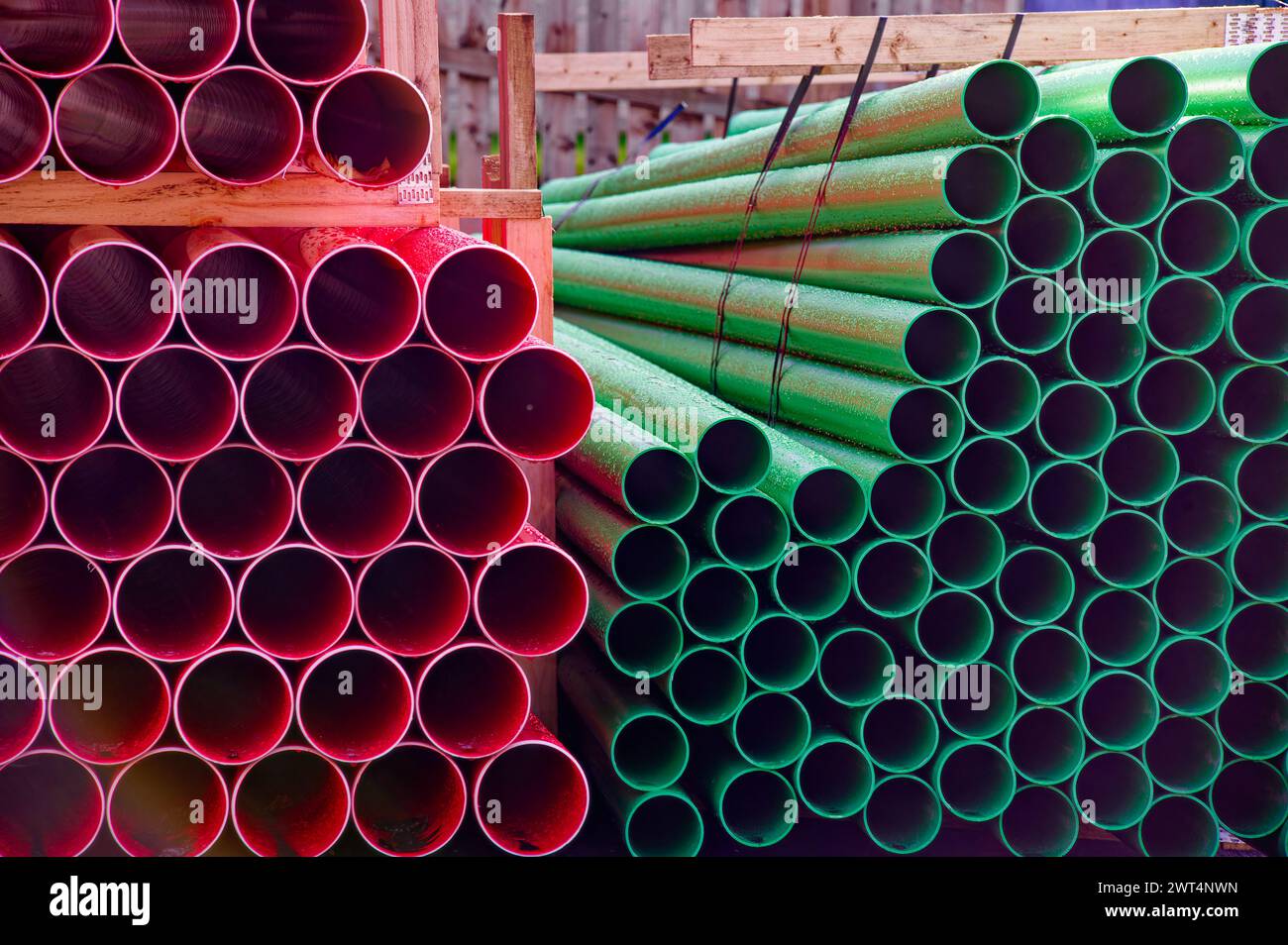 Plastic ducts stacked for underground cables at construction site Stock ...