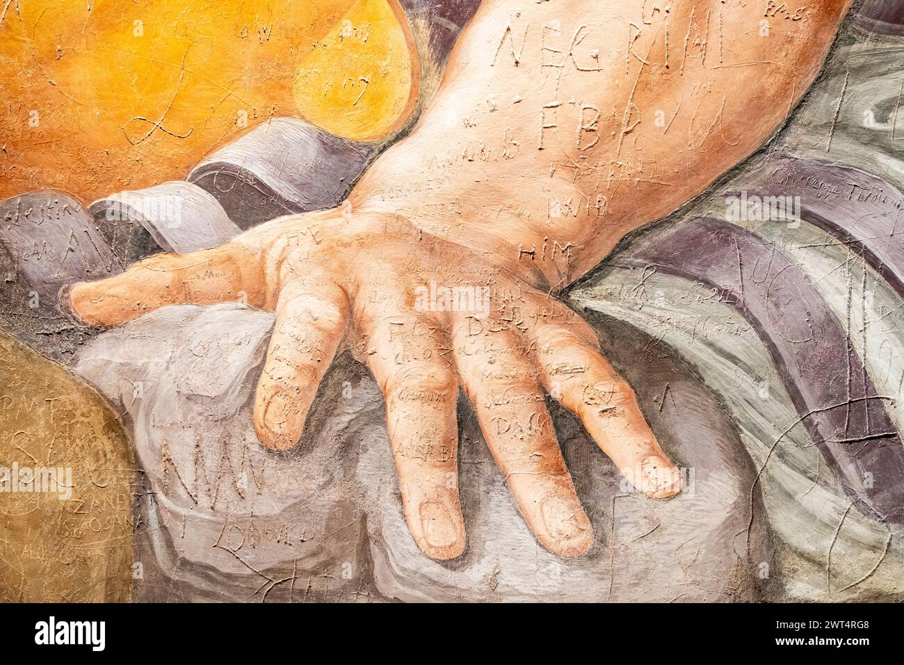 Image of captures the enduring marks of graffiti carved into an ancient ...