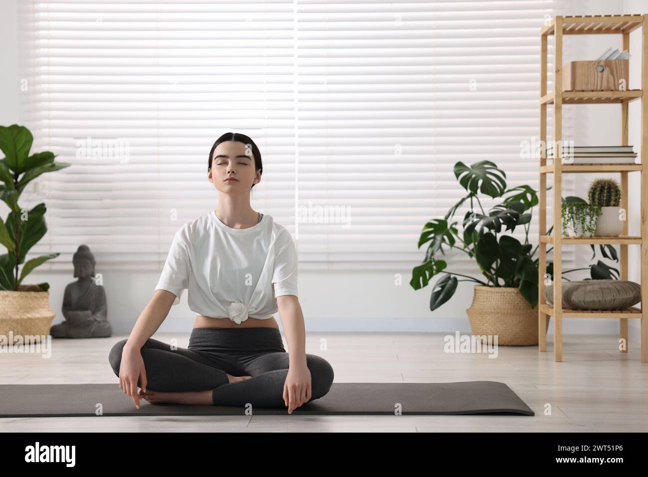 Caucasian teen girl meditating hi-res stock photography and images - Alamy
