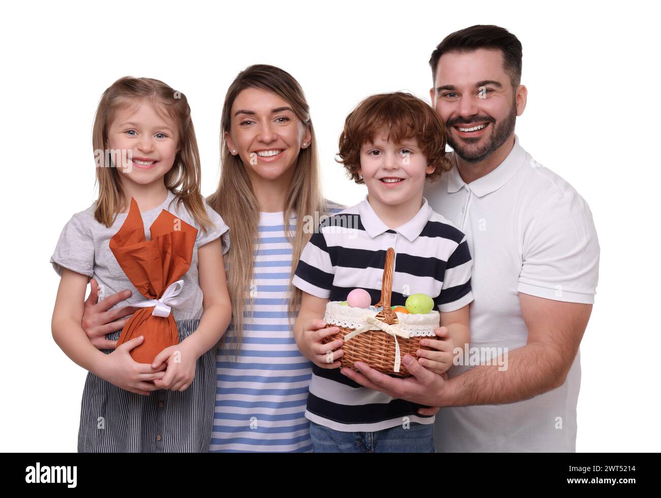 Easter celebration. Happy family with wrapped egg and wicker basket ...