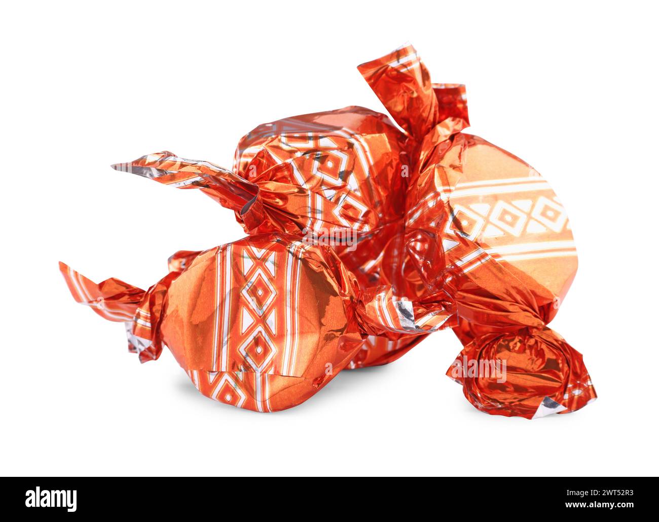 Candies in orange wrappers isolated on white Stock Photo - Alamy