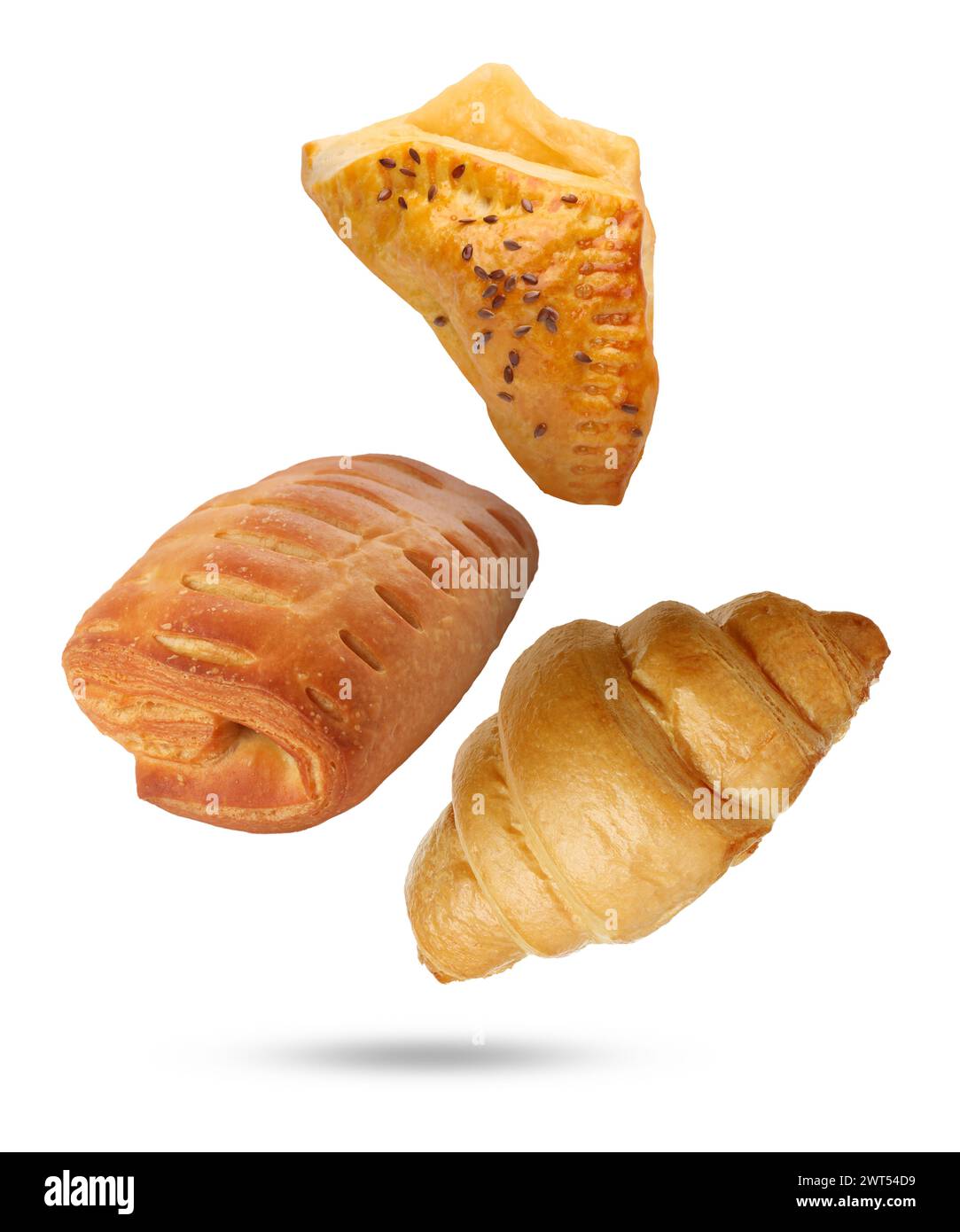 Different tasty puff pastries falling on white background Stock Photo ...