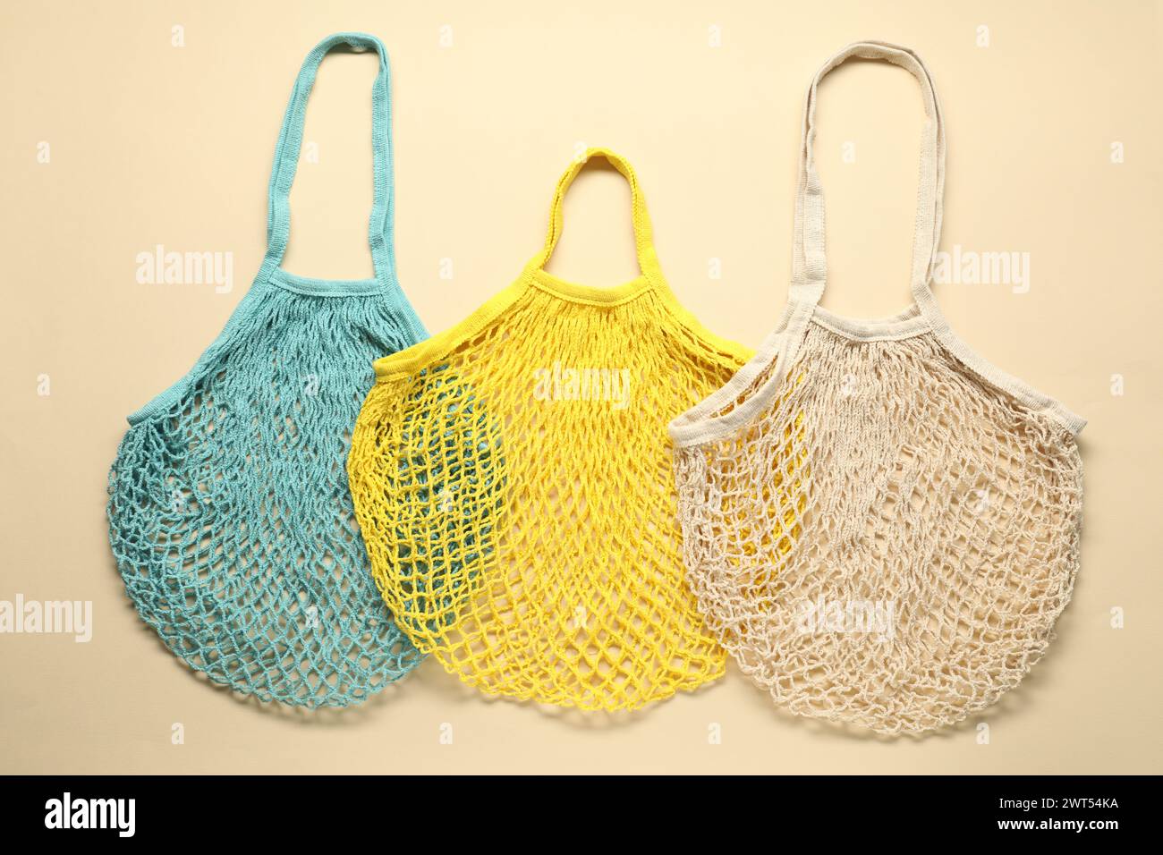 String bags on beige background, top view Stock Photo - Alamy