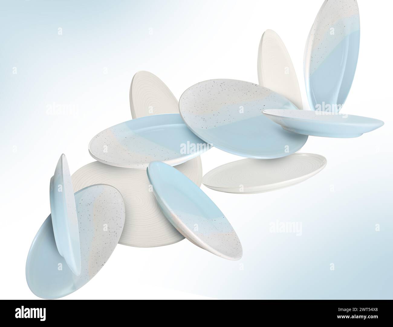 Clean ceramic plates falling on light blue background Stock Photo - Alamy